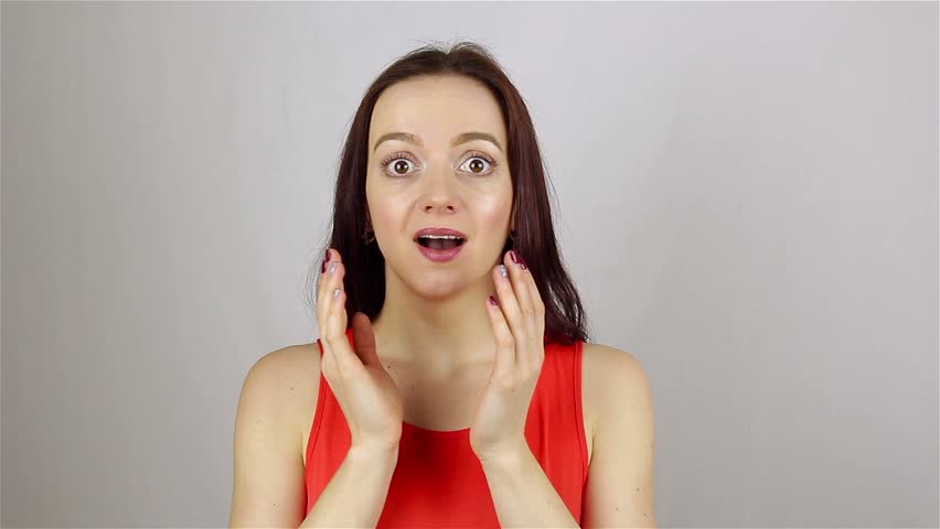 beautiful woman gets shock on white Stock Footage Video (100% Royalty ...