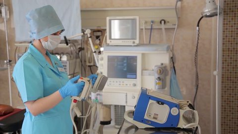 Female Nurse Prepares Defibrillator Surgical Operation Stock Footage ...