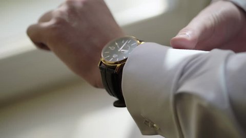 business man puts on watch getting Stock Footage Video (100% Royalty ...