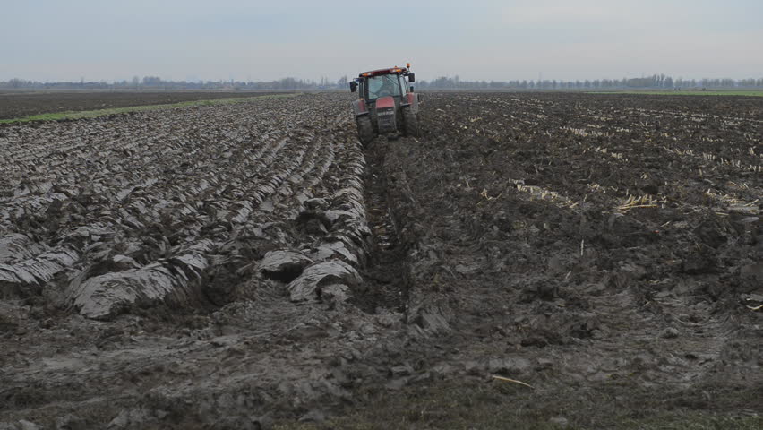 Tractor Plowing Heavy Muddy Farmland Stock Footage Video (100% Royalty ... Tractor Plowing Heavy Muddy Farmland Stock Footage Video (100% Royalty ...