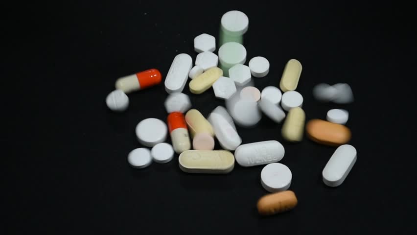 Pills and Capsules Drop On Stock Footage Video (100% Royalty-free ...