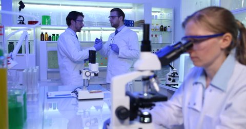 Scientific Researchers Talking Collaborate Microscope Research Stock ...