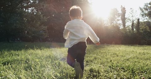 Little Boy Running Outside Ultra Slow Stock Footage Video (100% Royalty ...