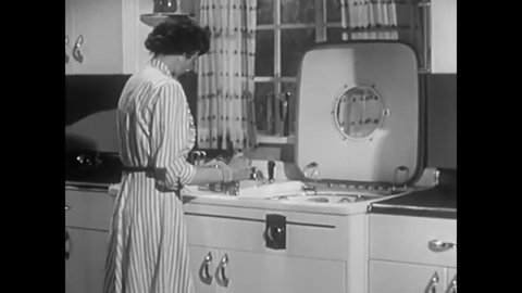 Circa 1950s Housewife Loads Automatic Dishwasher Stock Footage Video ...