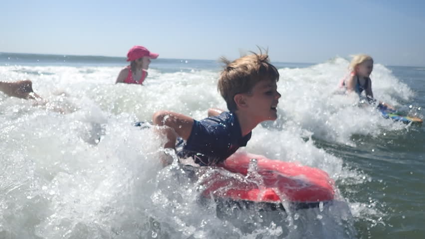 children bodyboarding ocean waves myrtle beach Stock Footage Video (100 ...