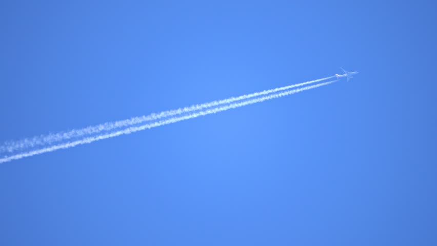 engine exhaust contrails forming behind flying Stock Footage Video (100 ...