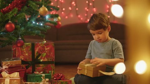 Adorable Little Boy Finds Opens His Stock Footage Video (100% Royalty ...