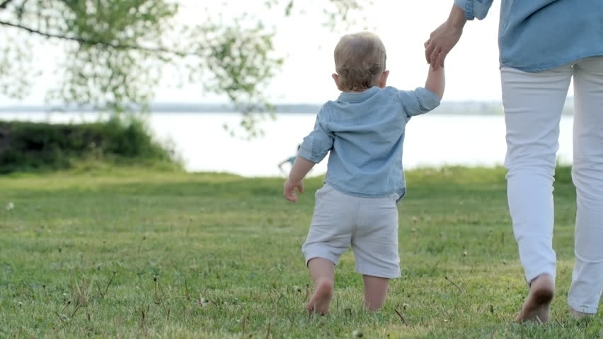 tilt rear view toddler boy holding Stock Footage Video (100% Royalty ...