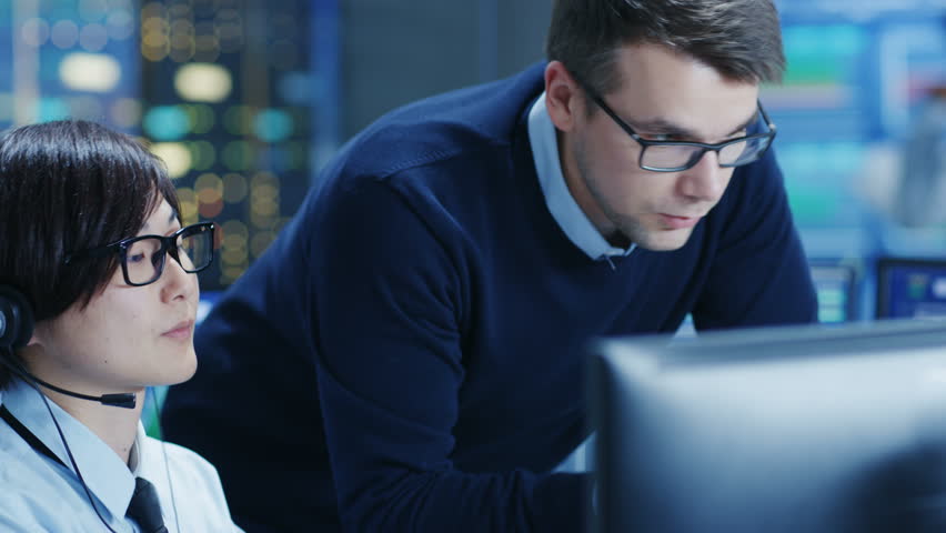 network operations center senior trader teaches Stock Footage Video ...