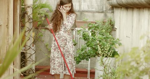 Beautiful Young Female Model Sweeping Floor Stock Footage Video (100% ...