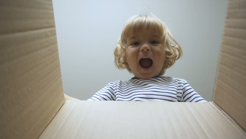 little boy looks box surprised happy Stock Footage Video (100% Royalty ...
