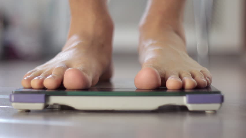 man measuring weight on health scale Stock Footage Video (100% Royalty ...
