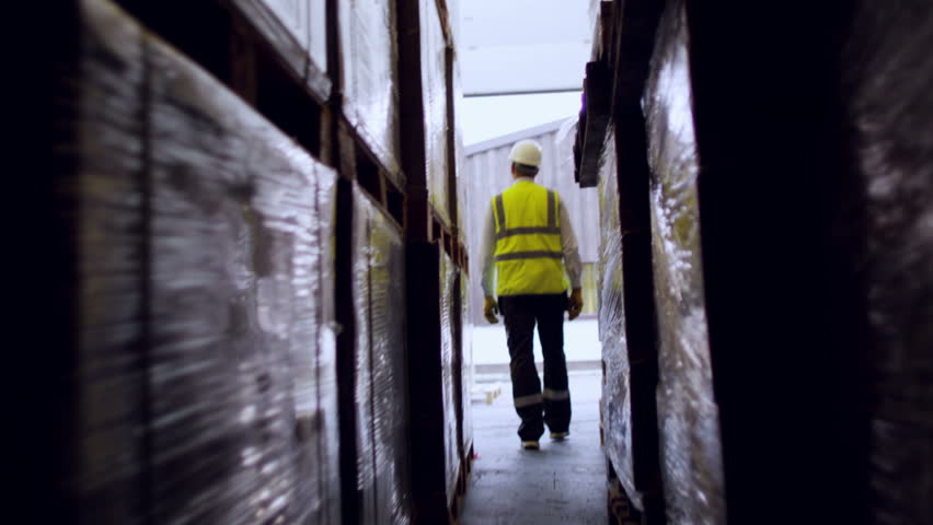 industrial worker walks through dark narrow Stock Footage Video (100% ...