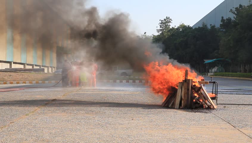 Firefighters Fighting Fire On Training. Stock Footage Video (100% ...
