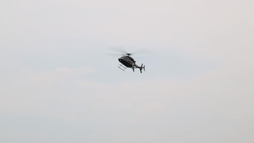 A Helicopter Flying Over Houses, Stock Footage Video (100% Royalty-free ...