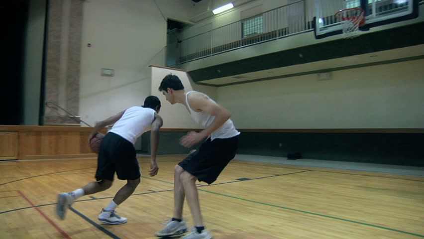 young college students practicing basketball together Stock Footage ...