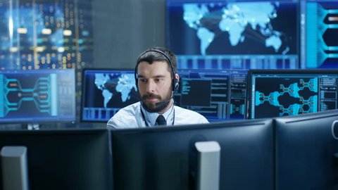 System Control Room Dispatcher Talks Into Stock Footage Video (100% ...