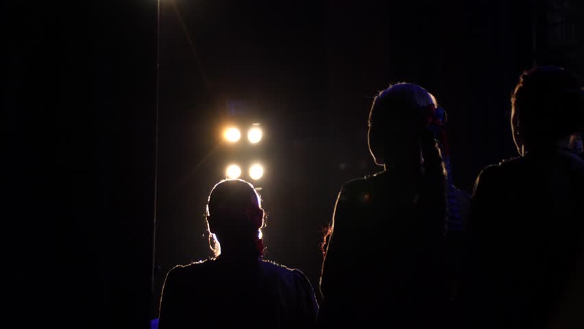 silhouette actors spotlight artists on stage Stock Footage Video (100% ...
