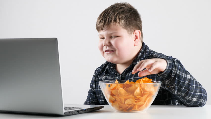 Young Fat Boy Eats Chips Stock Footage Video (100% Royalty-free ...