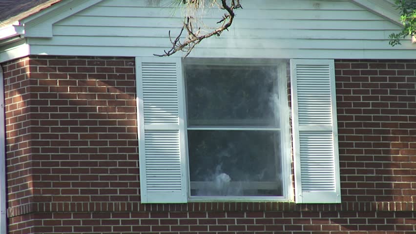 house fire smoke seeping out window Stock Footage Video (100% Royalty ...