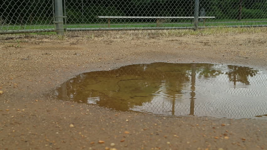 puddle on baseball field Stock Footage Video (100% Royalty-free ...