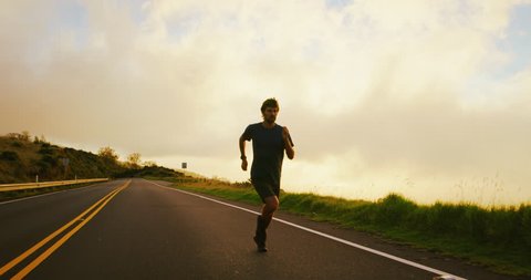 Athletic Young Man Running On Road Stock Footage Video (100% Royalty ...