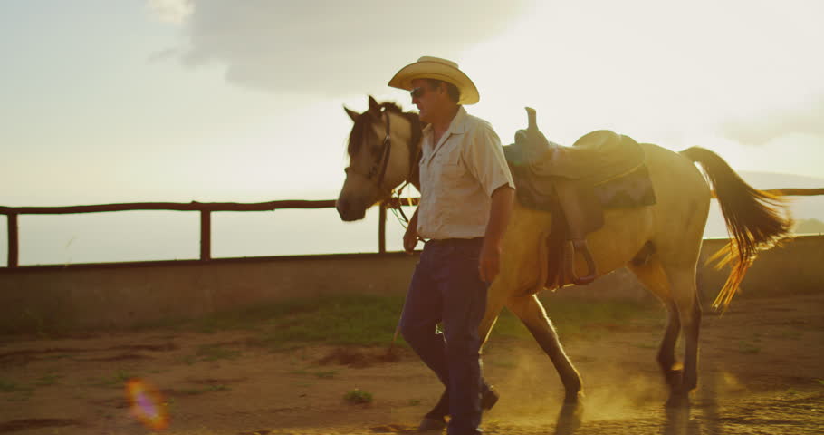 Cowboy Walking with His Horse Stock Footage Video (100% Royalty-free ...