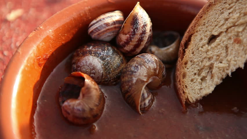 man eating snails typical spanish way Stock Footage Video (100% Royalty ...