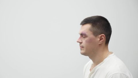 man turning his head against plain Stock Footage Video (100% Royalty ...