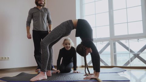 Little Girl Makes Bridge Pose Has Stock Footage Video (100% Royalty ...