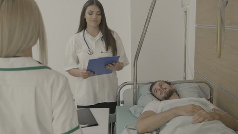 Nurses Talking Each Other While Patient Stock Footage Video (100% ...