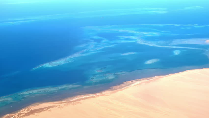 Line between desert and ocean water, high altitude aerial view | freepik