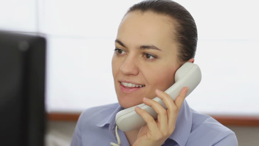 woman talking on landline phone front Stock Footage Video (100% Royalty ...
