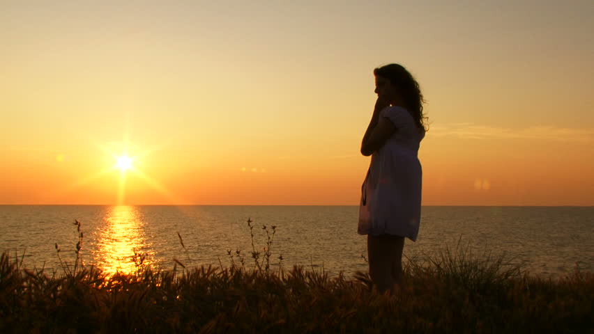 beautiful woman standing on beach sunset Stock Footage Video (100% ...