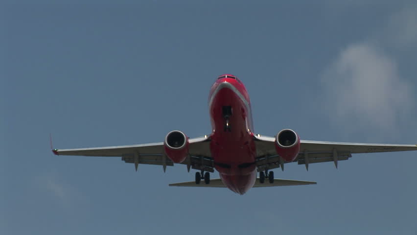 Red Passenger Jetliner Overhead Landing Stock Footage Video (100% ...