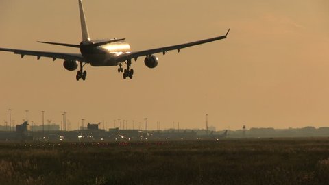 airplane landing runway sunset back view Stock Footage Video (100% ...