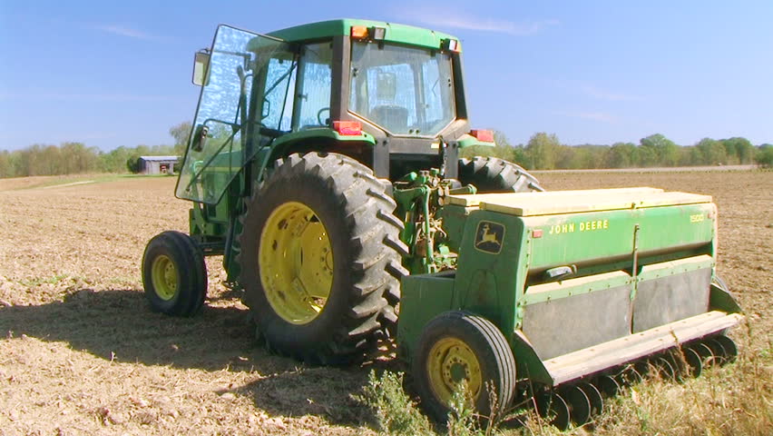 farmer sowing wheat crop using tractor Stock Footage Video (100% ...