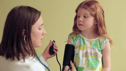 Female Pediatrician Taking Blood Pressure Female Stock Footage Video ...