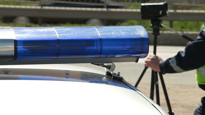 police officer using radar speed gun Stock Footage Video (100% Royalty ...