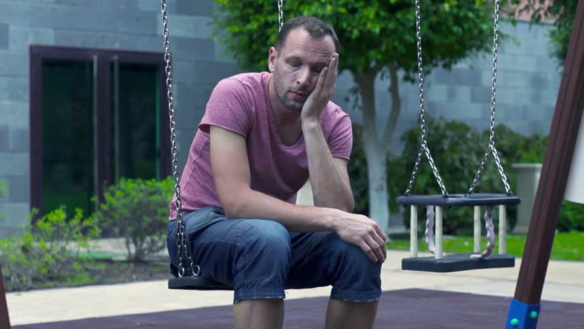 sad man sitting on swing slow Stock Footage Video (100% Royalty-free ...