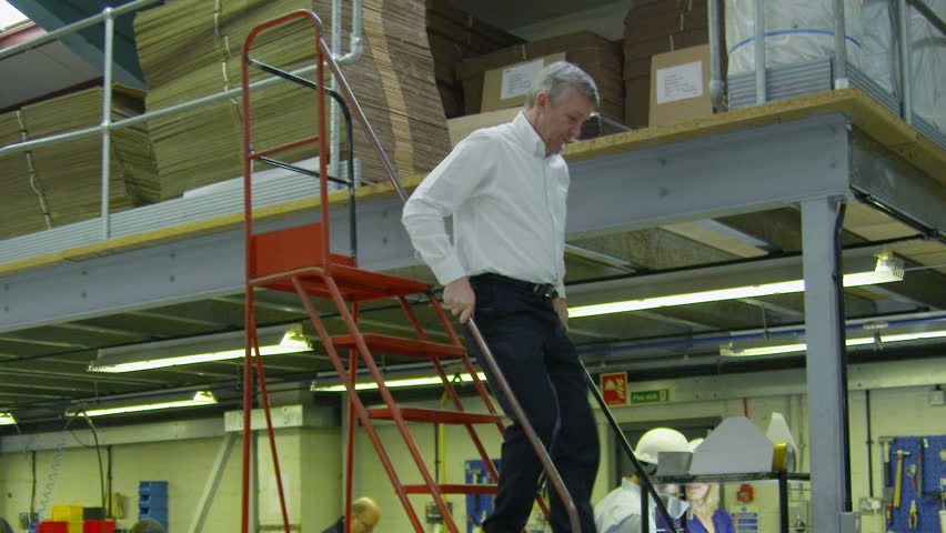 mature factory warehouse manager having friendly Stock Footage Video ...