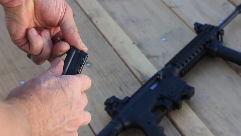 Loading Bullets Into a High Stock Footage Video (100% Royalty-free ...