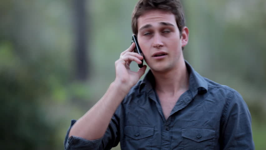 casual young man receiving phone call Stock Footage Video (100% Royalty ...