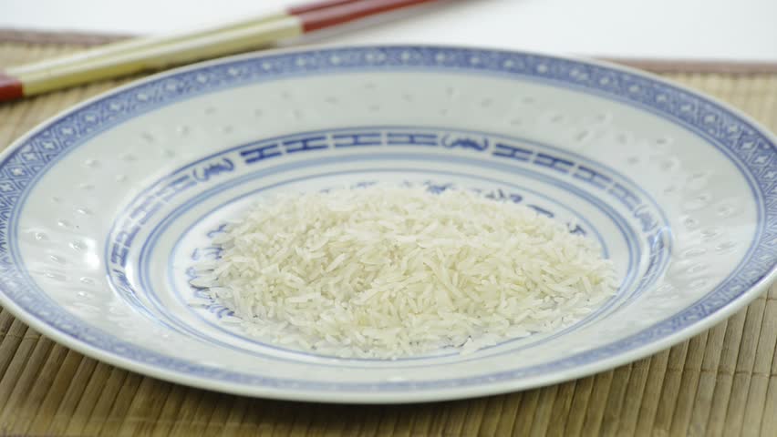 basmati rice falling on chinese plate Stock Footage Video (100% Royalty ...