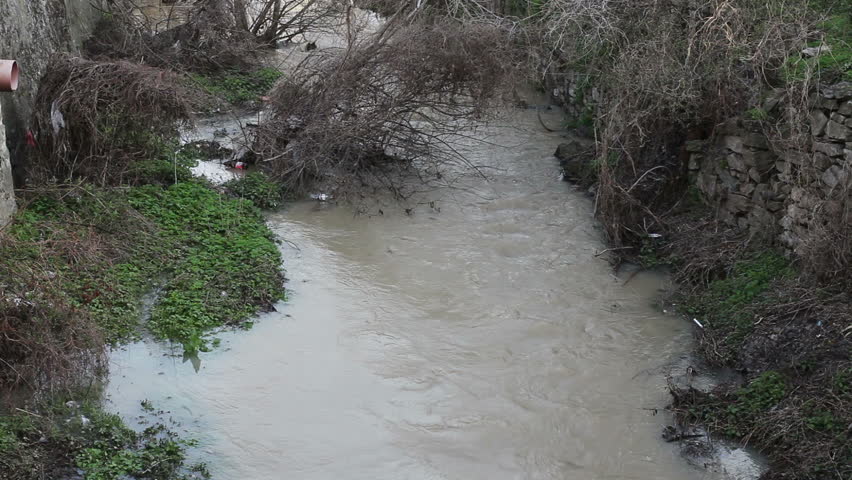dirty river flows Stock Footage Video (100% Royalty-free) 4222180 ...
