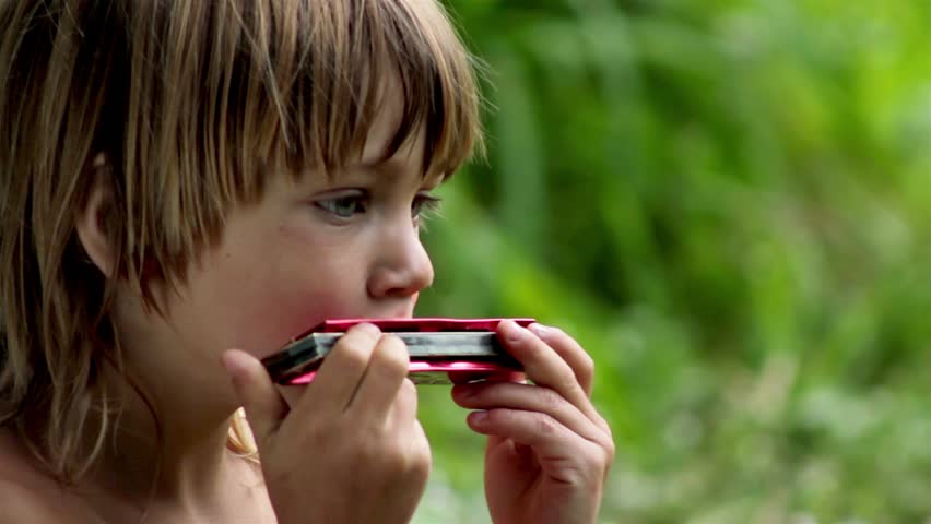 little boy playing harmonica Stock Footage Video (100% Royalty-free) 4290923 | Shutterstock