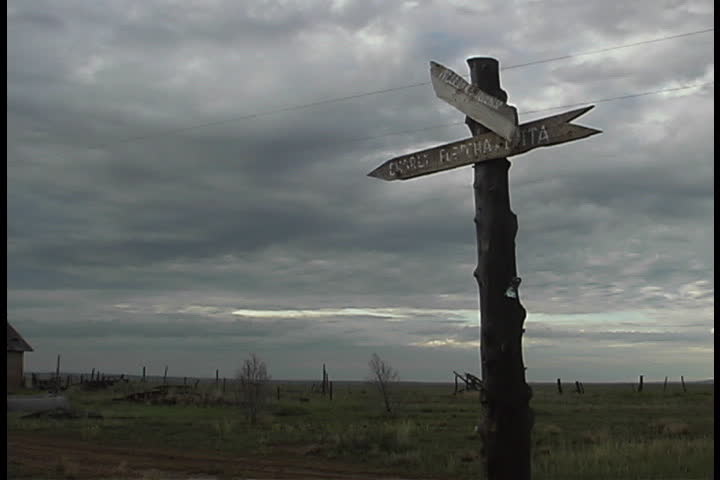 weathered signpost stands on plain under Stock Footage Video (100% ...