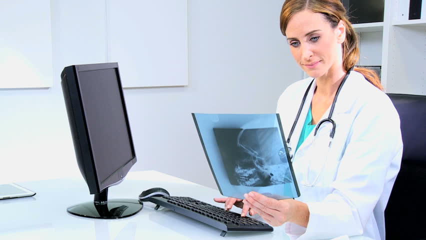 young female medical doctor updating patient Stock Footage Video (100% ...