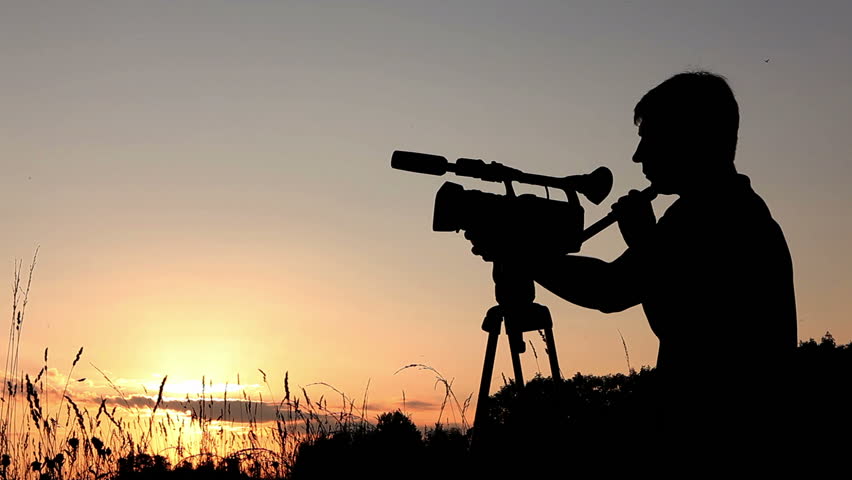 A Videographer Shoots Landscape at Stock Footage Video (100% Royalty ...