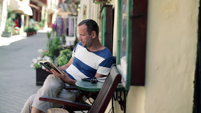 Young Man Reading Book in Stock Footage Video (100% Royalty-free ...